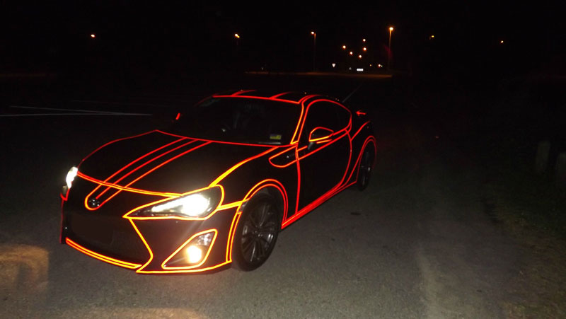 Guy Makes Tron Car Using Reflective Vinyl Tape - TwistedSifter