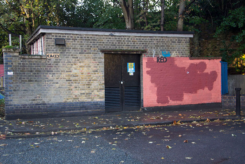 Street Artist and City Worker Have Year Long Exchange on a Red Wall in ...