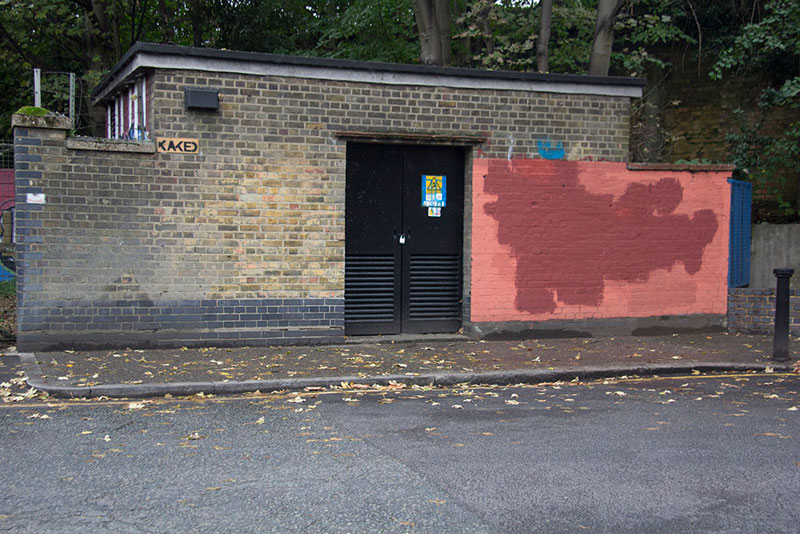 Street Artist and City Worker Have Year Long Exchange on a Red Wall in ...