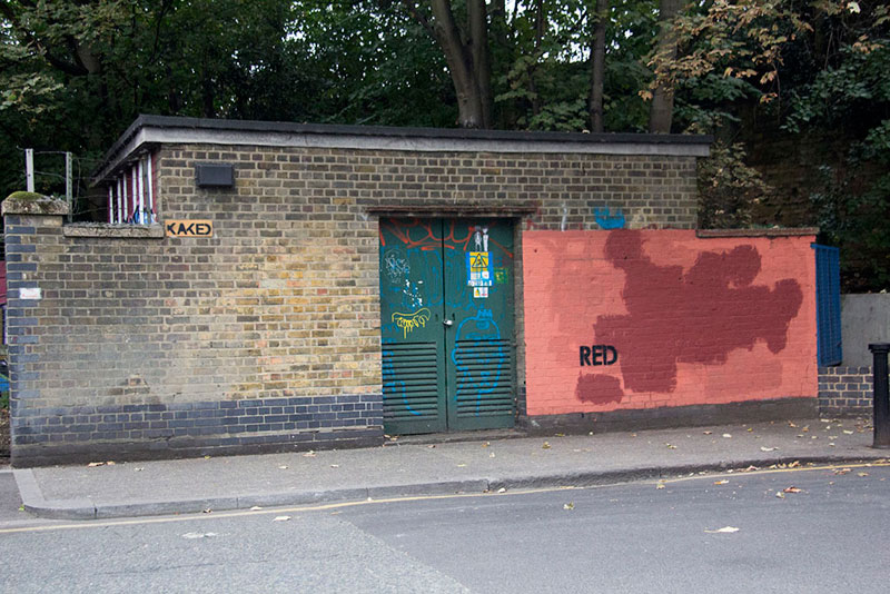 Street Artist and City Worker Have Year Long Exchange on a Red Wall in ...