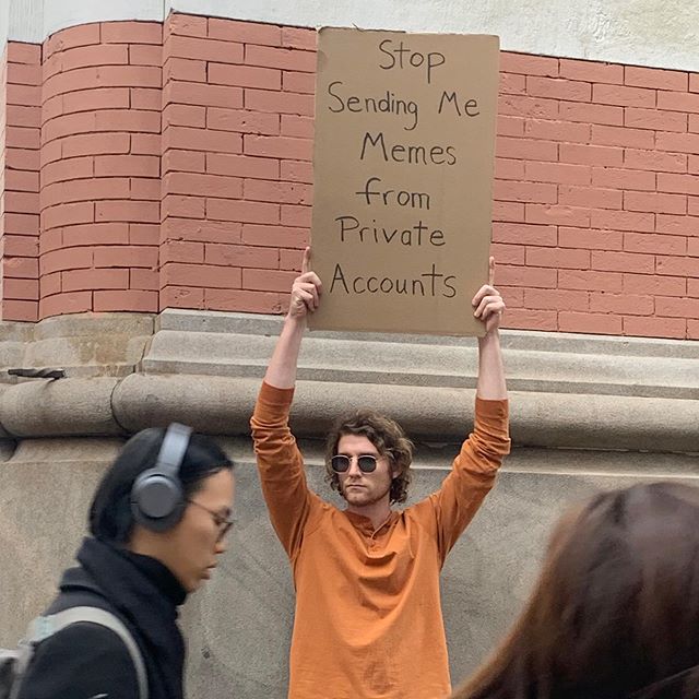 Dude with Sign Protests the Most Random Things (13 Photos) - TwistedSifter