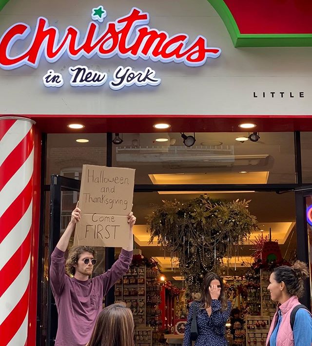 Dude with Sign Protests the Most Random Things (13 Photos) - TwistedSifter