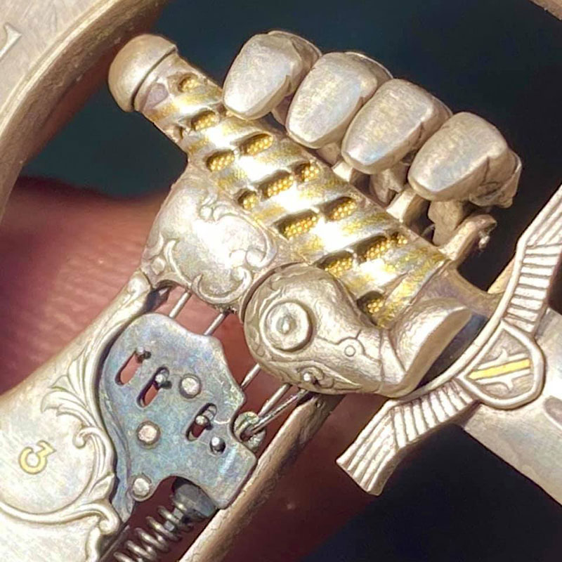 This Modified Silver Dollar has a Secret Button for Clasping the Sword ...