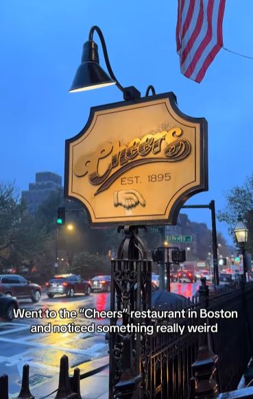 A Sign For The Bar Cheers In Boston Has A Weird Image On It, Which Has ...